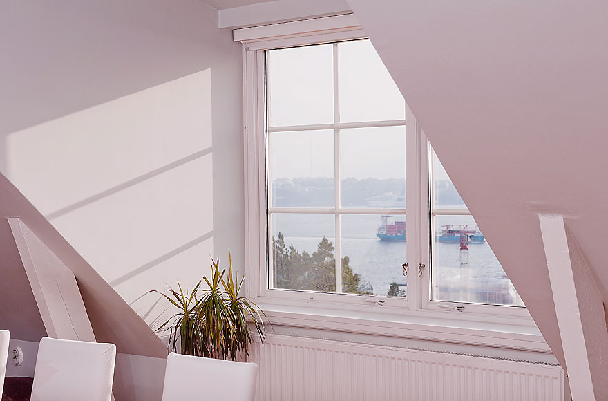White Sloped Ceiling Window with Lake Malaren Views - My Home Deco Mag